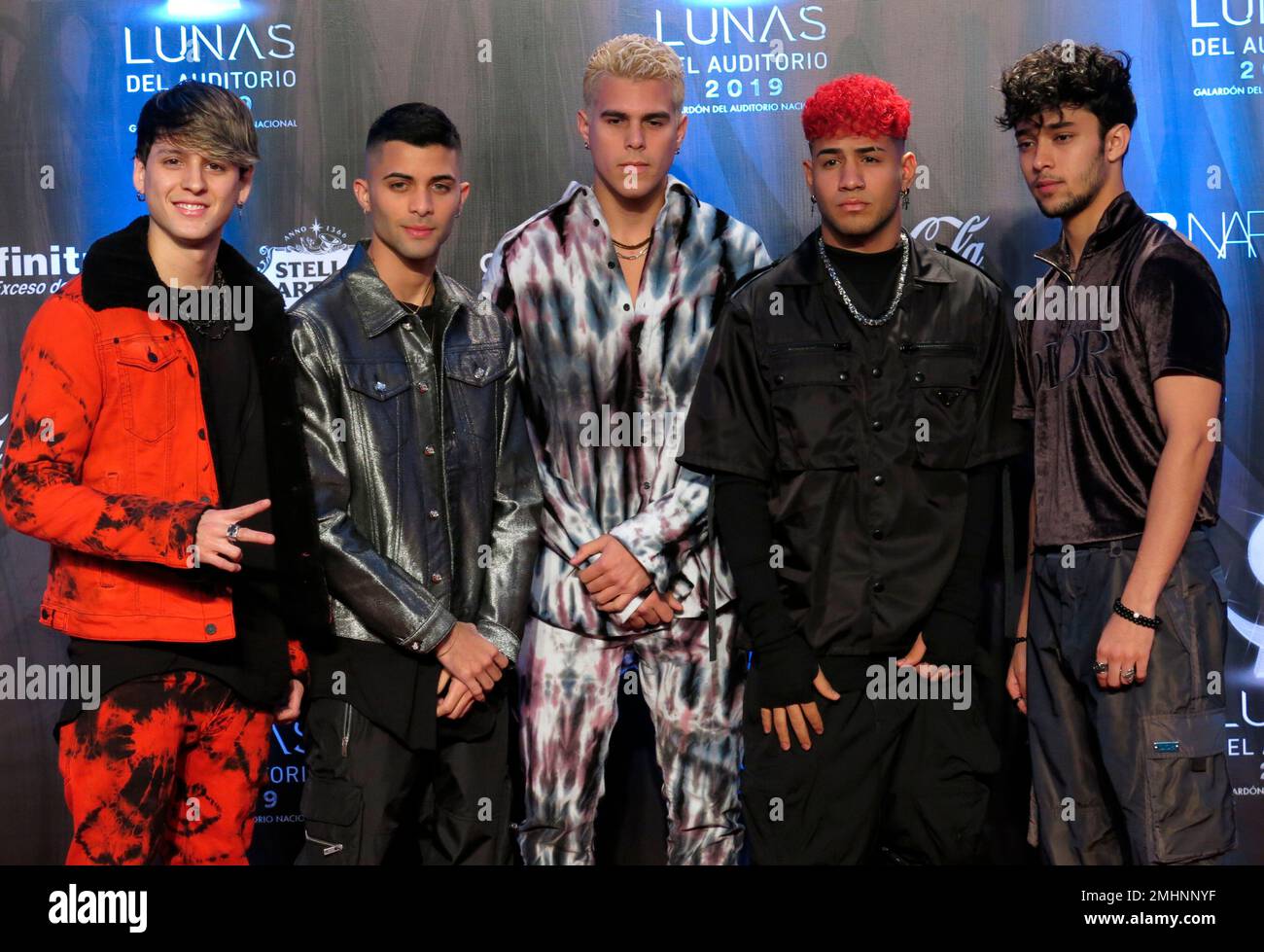 Members of the US band CNCO pose for photographers as they arrive for ...