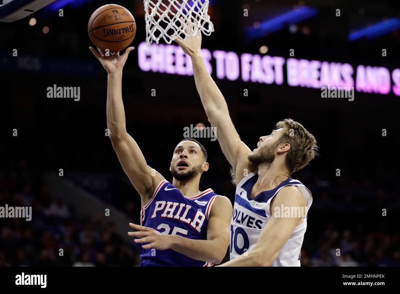 Philadelphia 76ers' Ben Simmons, left, shoots the ball as Minnesota ...