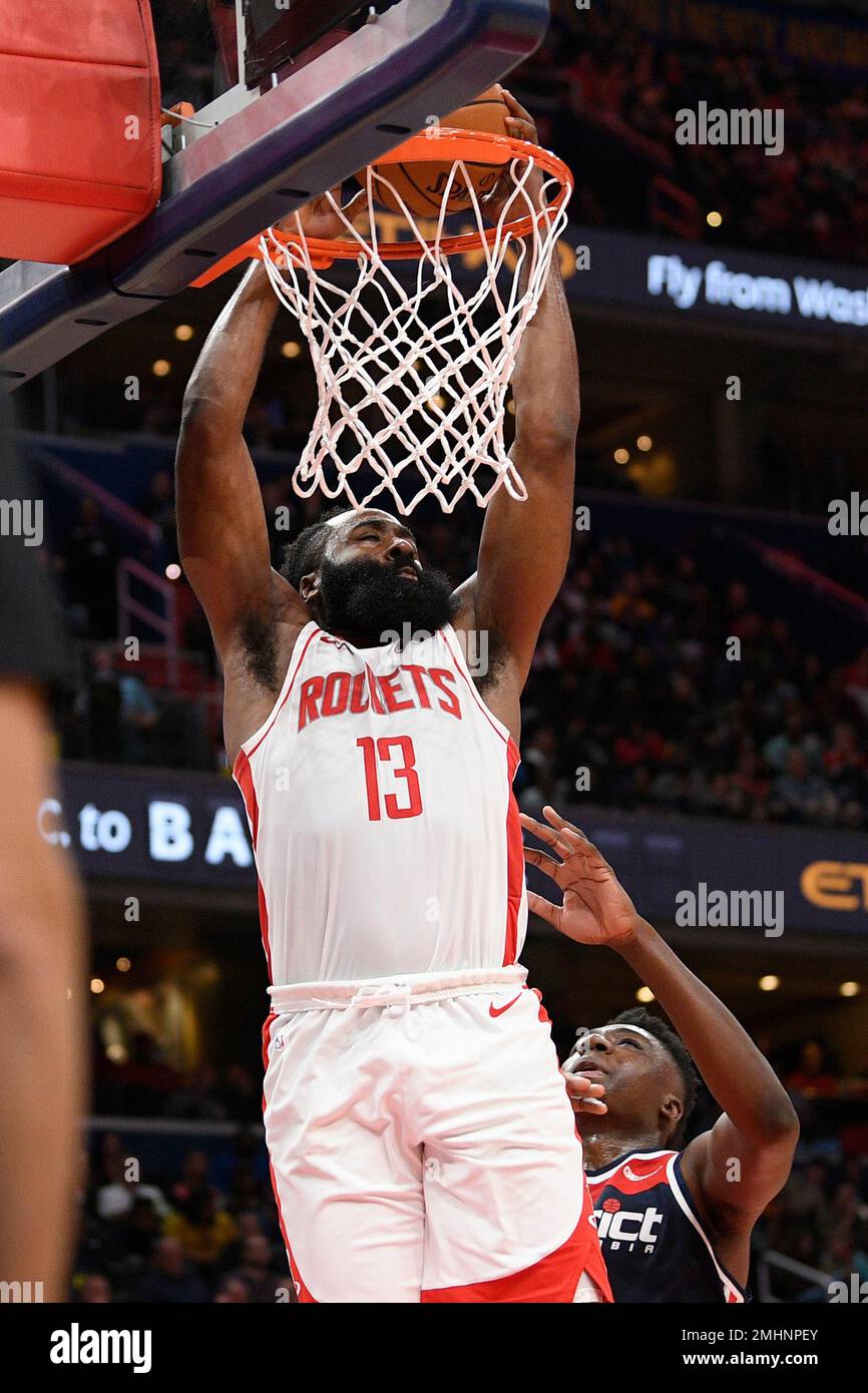 Houston Rockets guard James Harden (13) goes for the dunk against ...