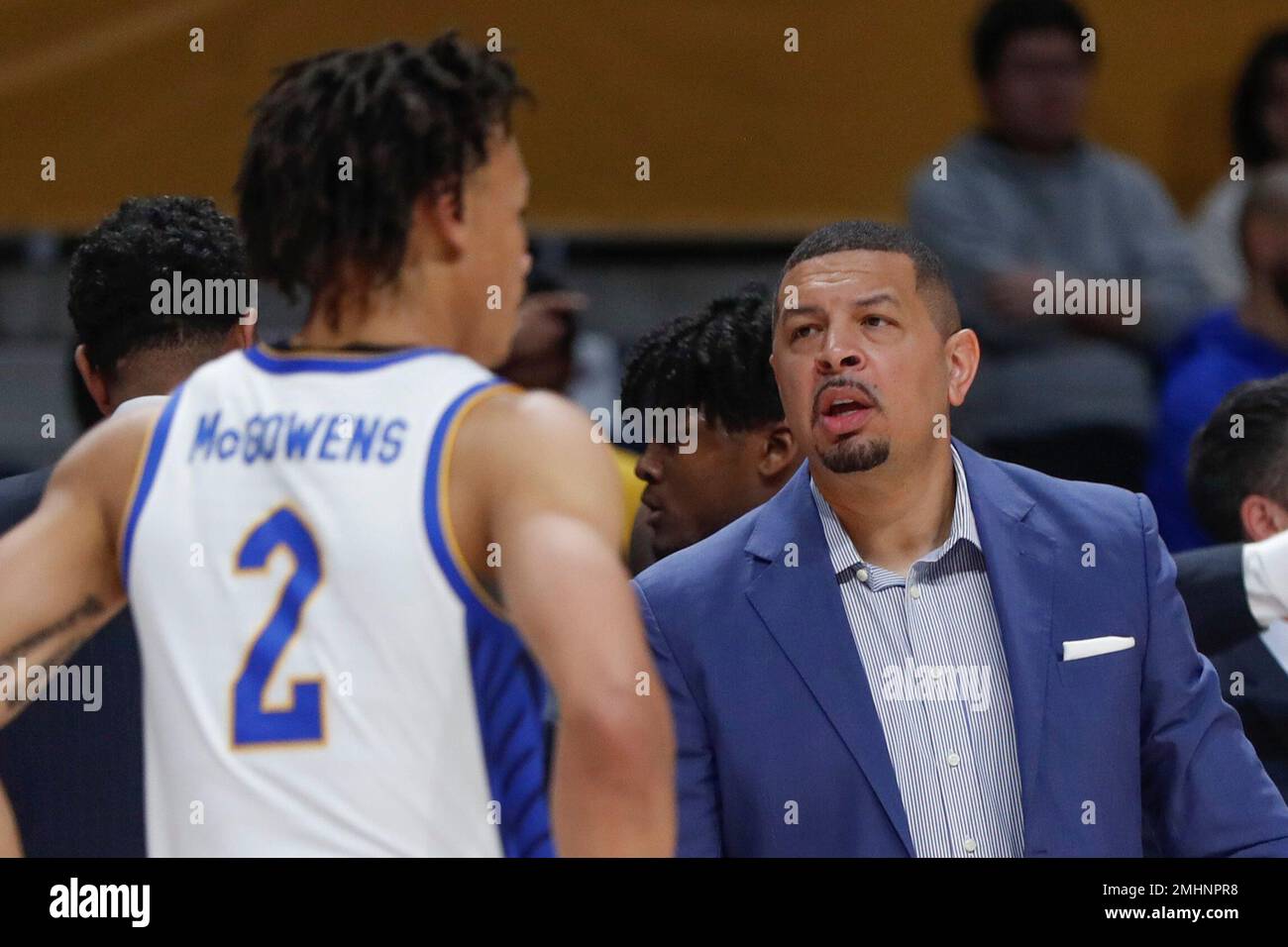 Pittsburgh head coach Jeff Capel , right, talks with Trey McGowens as ...