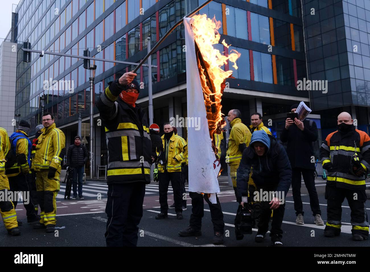 Brussels, Belgium. 27th Jan, 2023. A firefighter lights a banner on ...