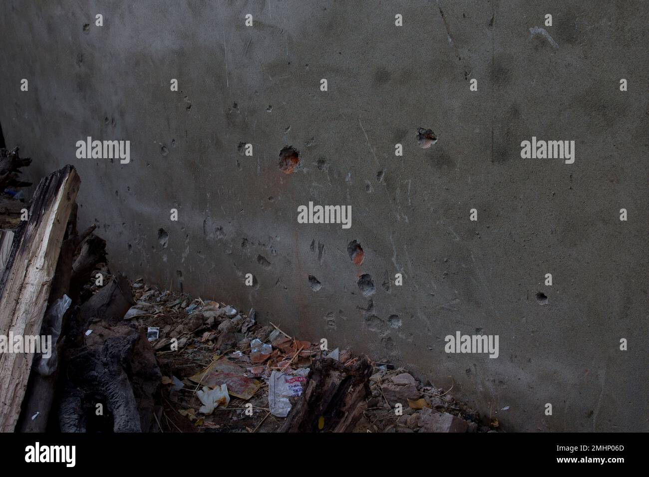 A bullet ridden wall is seen near the spot where Indian laborers where ...