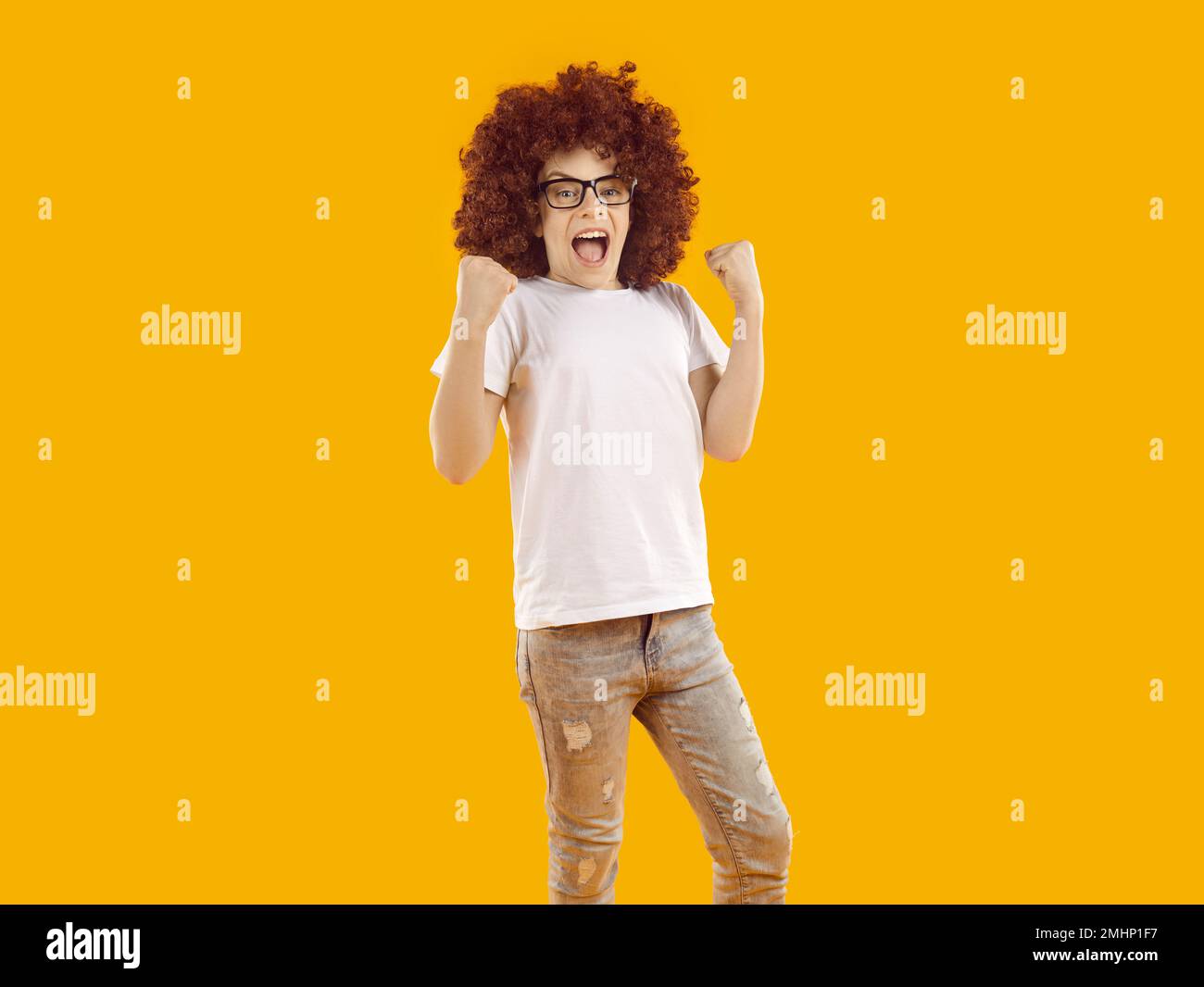 Happy funny excited little child celebrating success, doing yes gesture ...