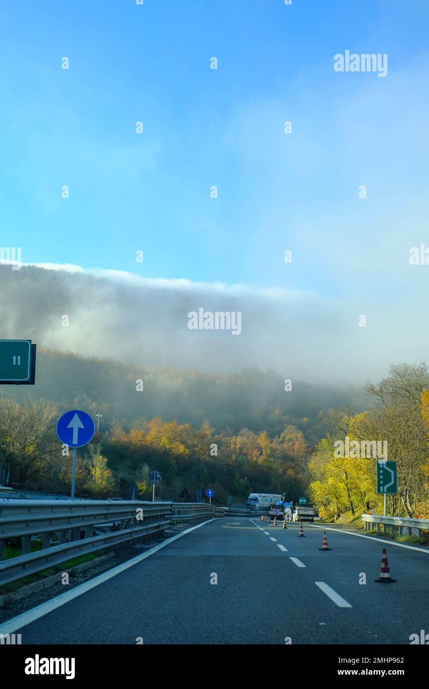 scenic highway in the mountains. car driving on a highway ...