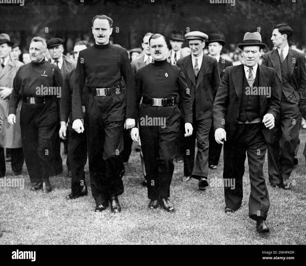 Sir Oswald Mosley, second from left, arrives at Victoria Park in London ...