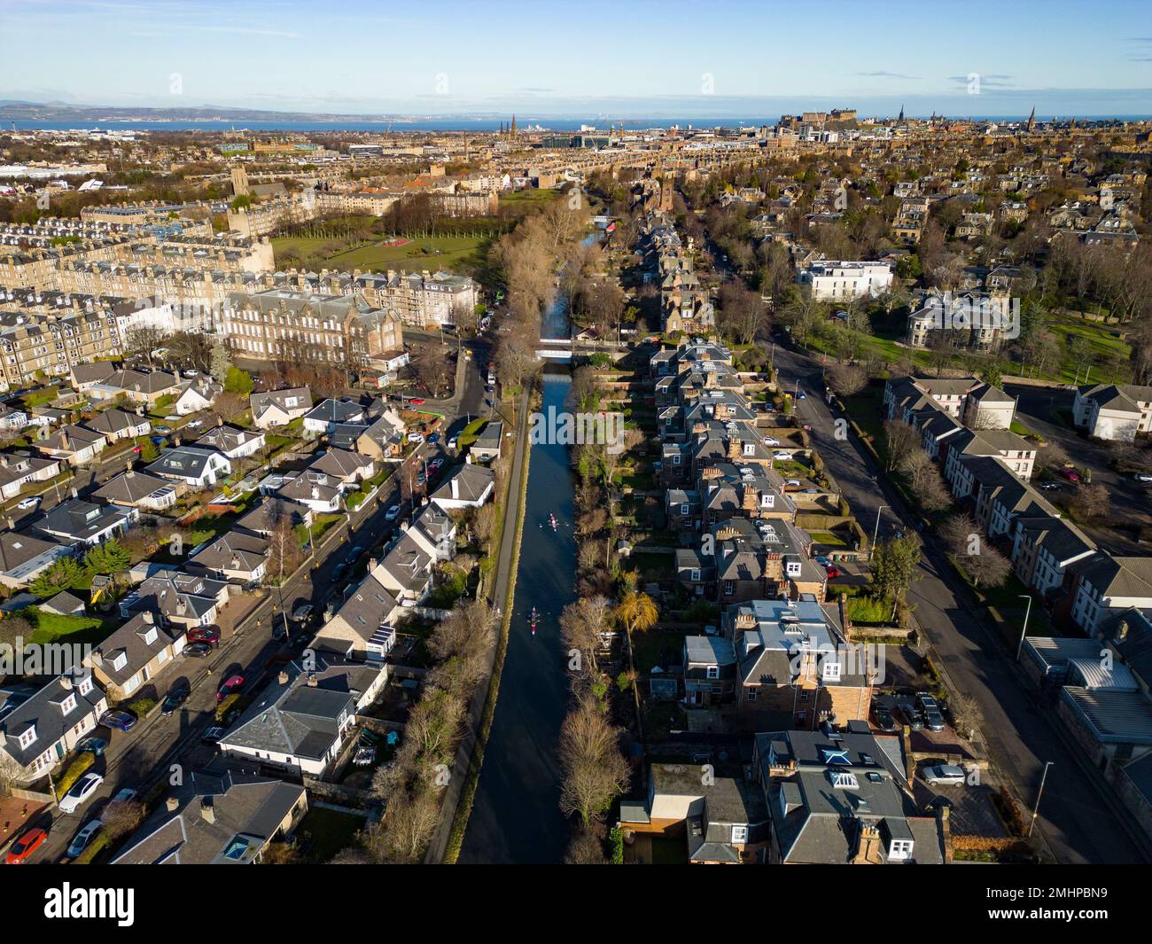 Aerial view from drone of Union Canal and Edinburgh skyline at Polwarth ...