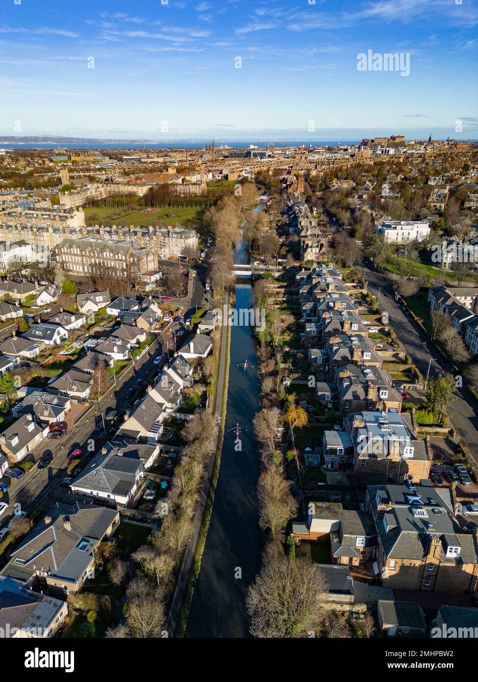 Aerial view from drone of Union Canal and Edinburgh skyline at Polwarth ...