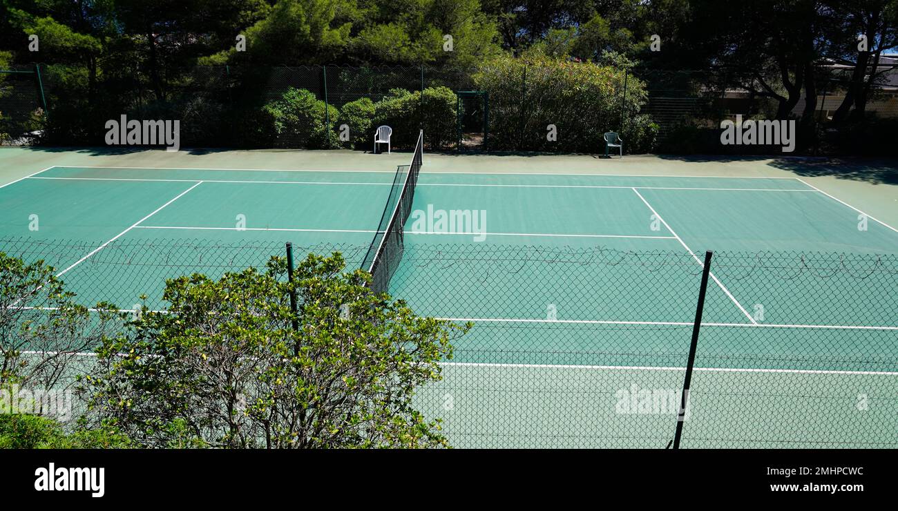 tennis court empty green with sport net in private house garden Stock ...