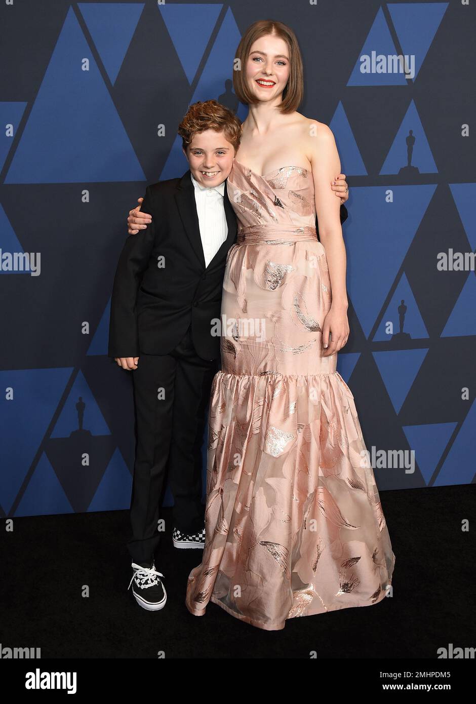 Roman Griffin Davis, left, and Thomasin McKenzie arrive at the ...