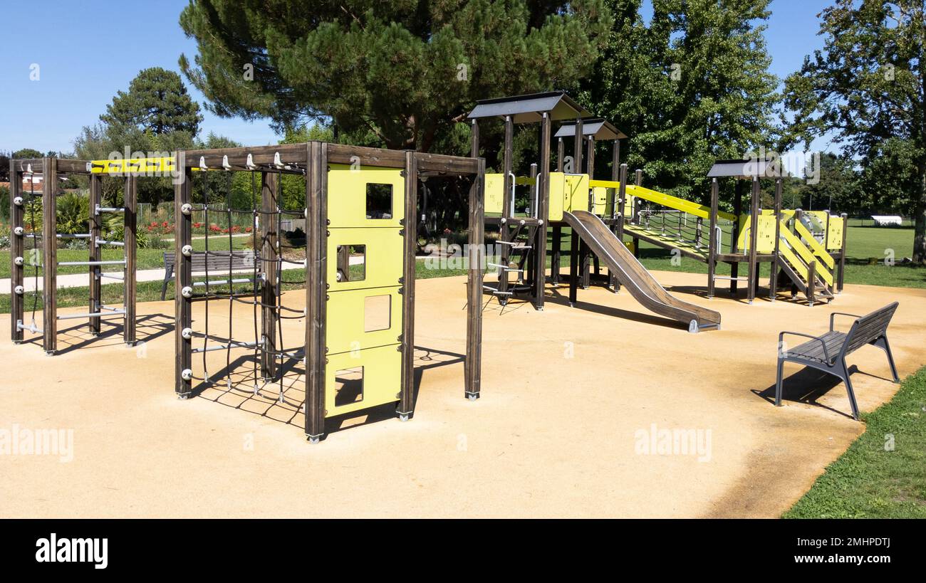 Children colored green and steel wooden slides colorful playground on ...