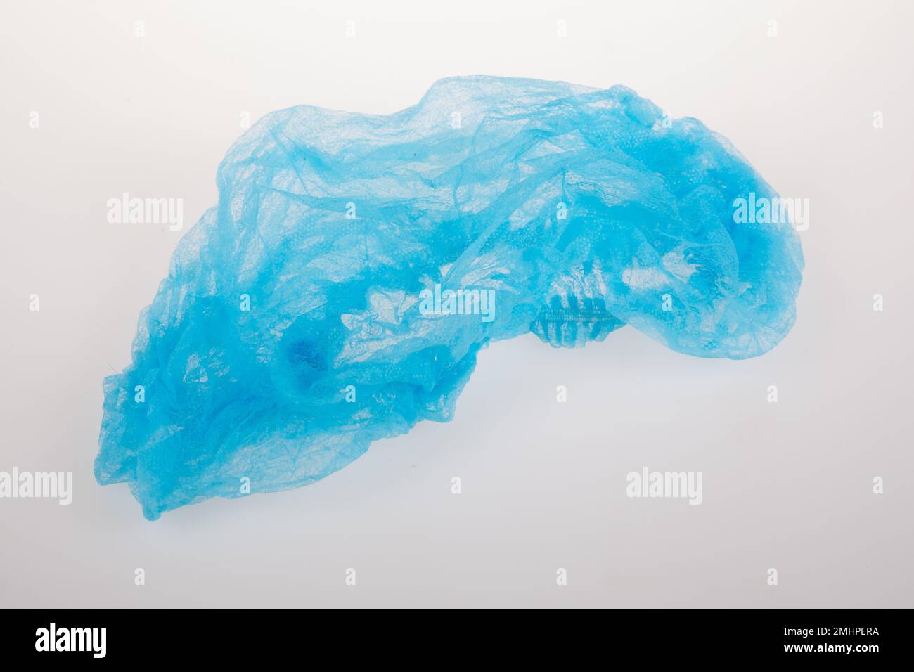 blue medical disposable cap hygiene head cover on grey background Stock ...