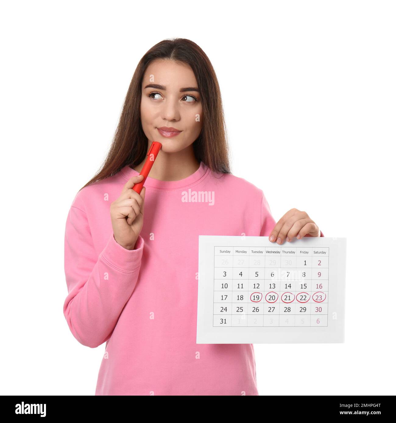 Young woman holding calendar with marked menstrual cycle days isolated ...