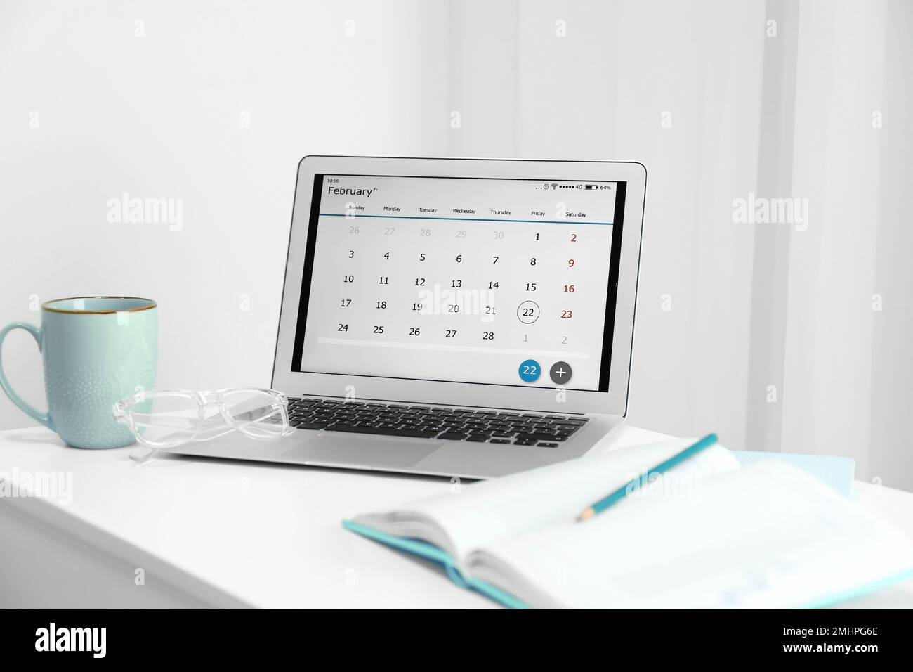 Modern laptop with calendar on screen in office Stock Photo - Alamy