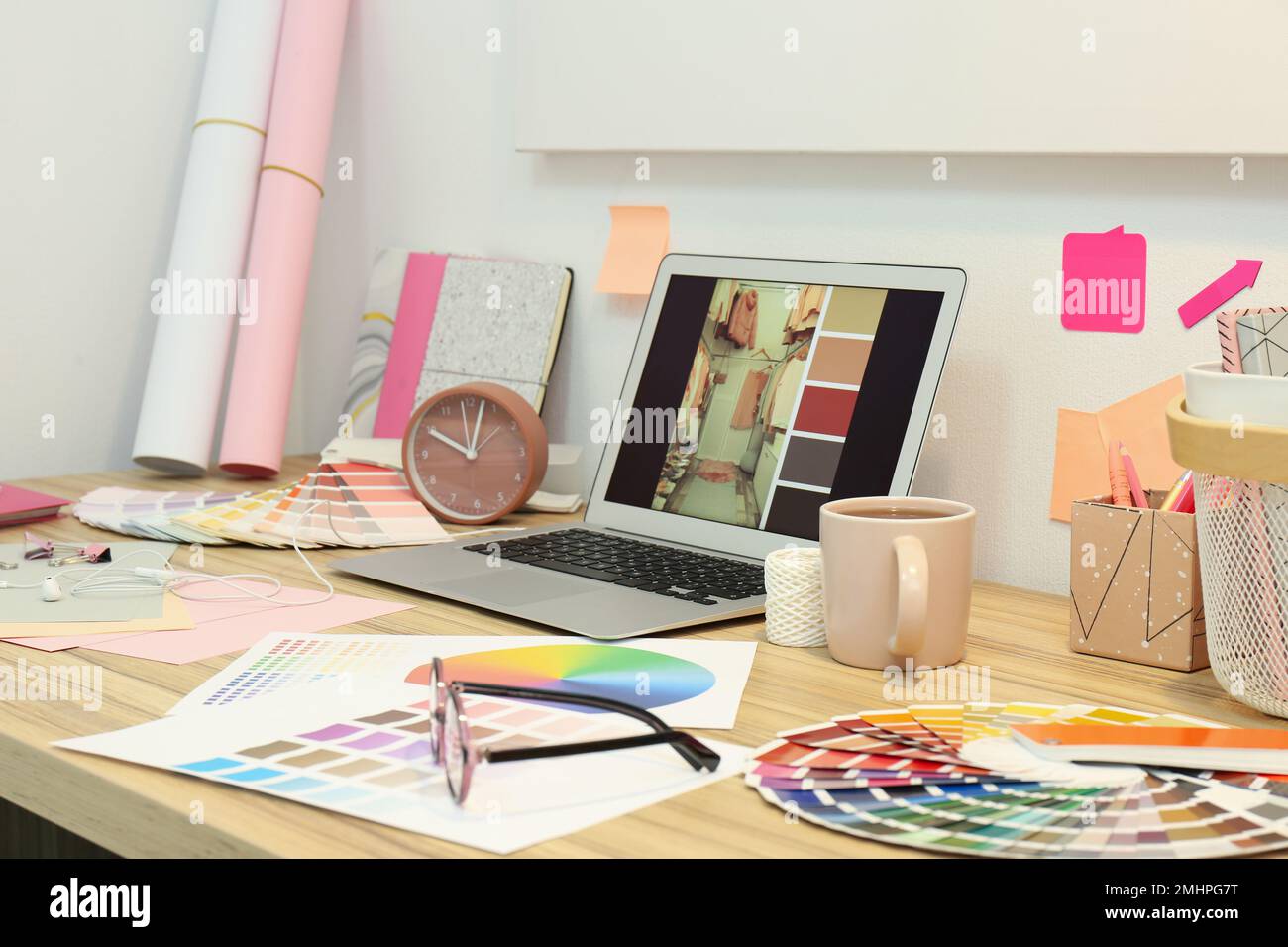 Designer's workplace with modern laptop and color palettes Stock Photo ...