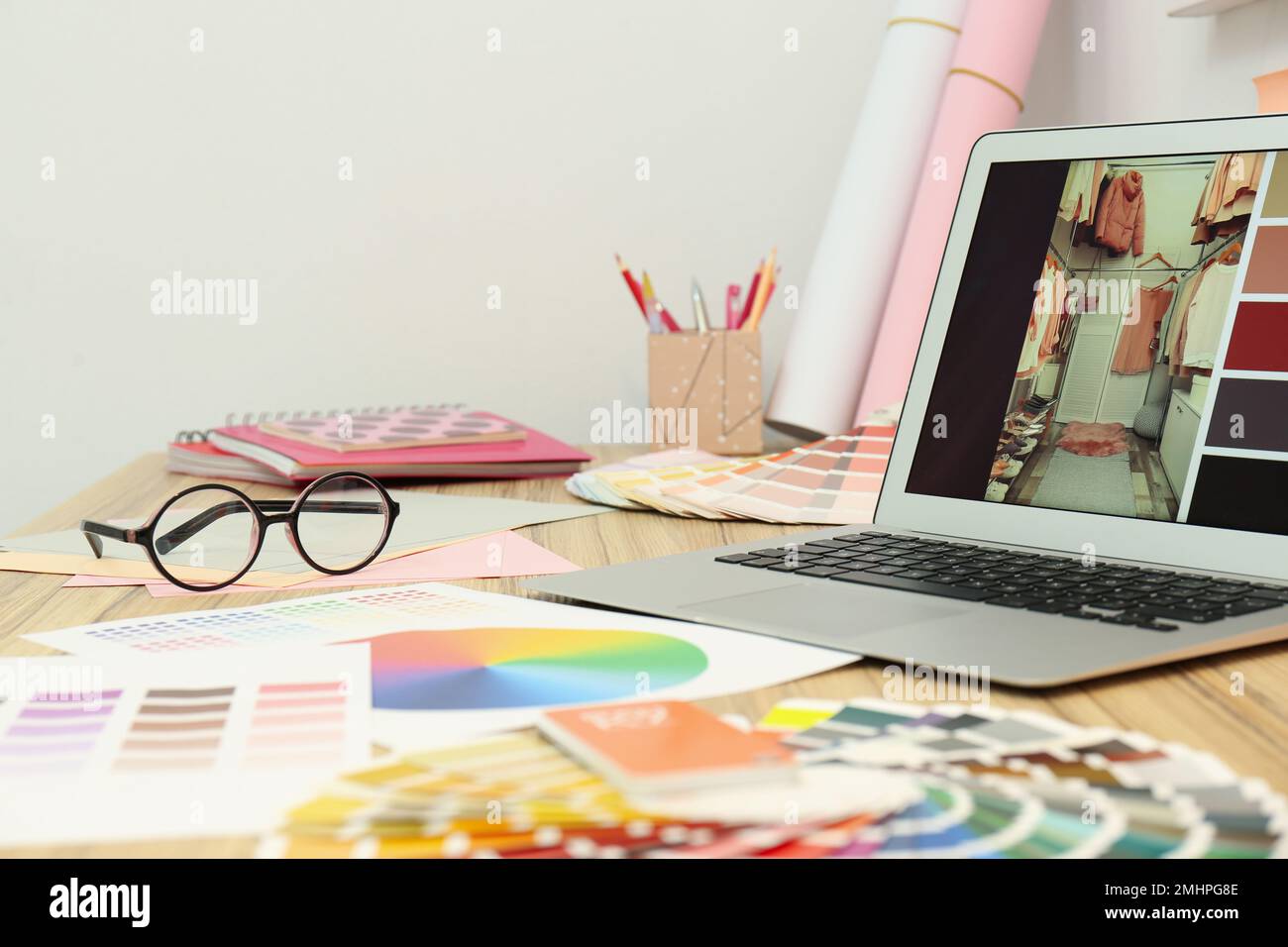 Designer's workplace with modern laptop and color palettes Stock Photo ...