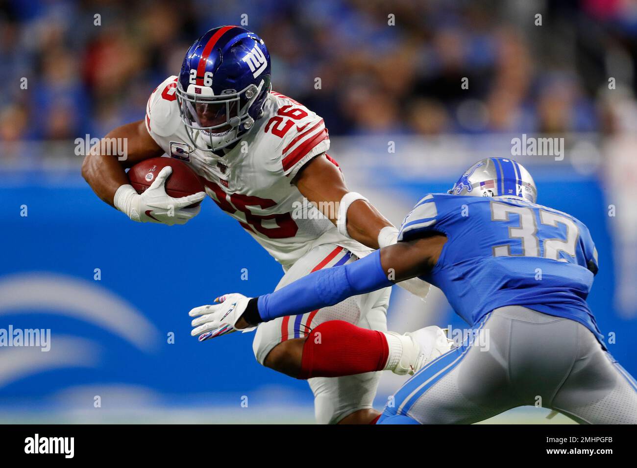 New York Giants running back Saquon Barkley (26) breaks the tackle of ...