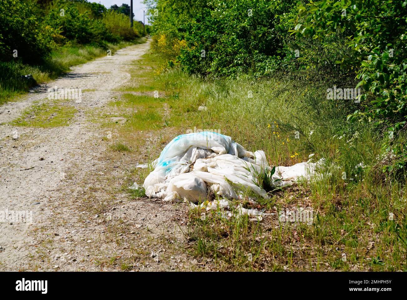 garbage site abandoned in the countryside near the road path ...