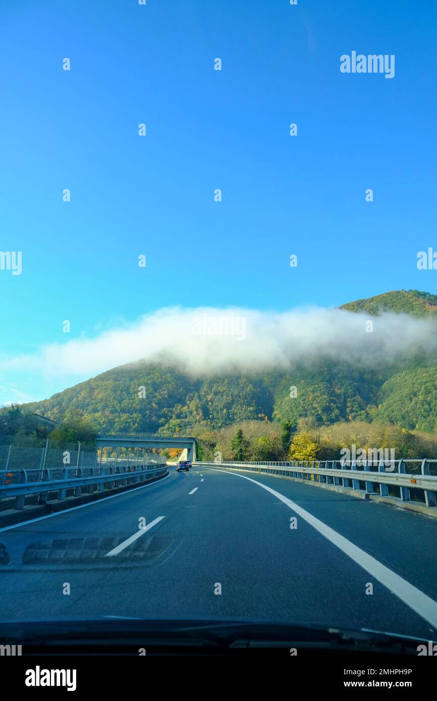 scenic highway in the mountains. car driving on a highway ...