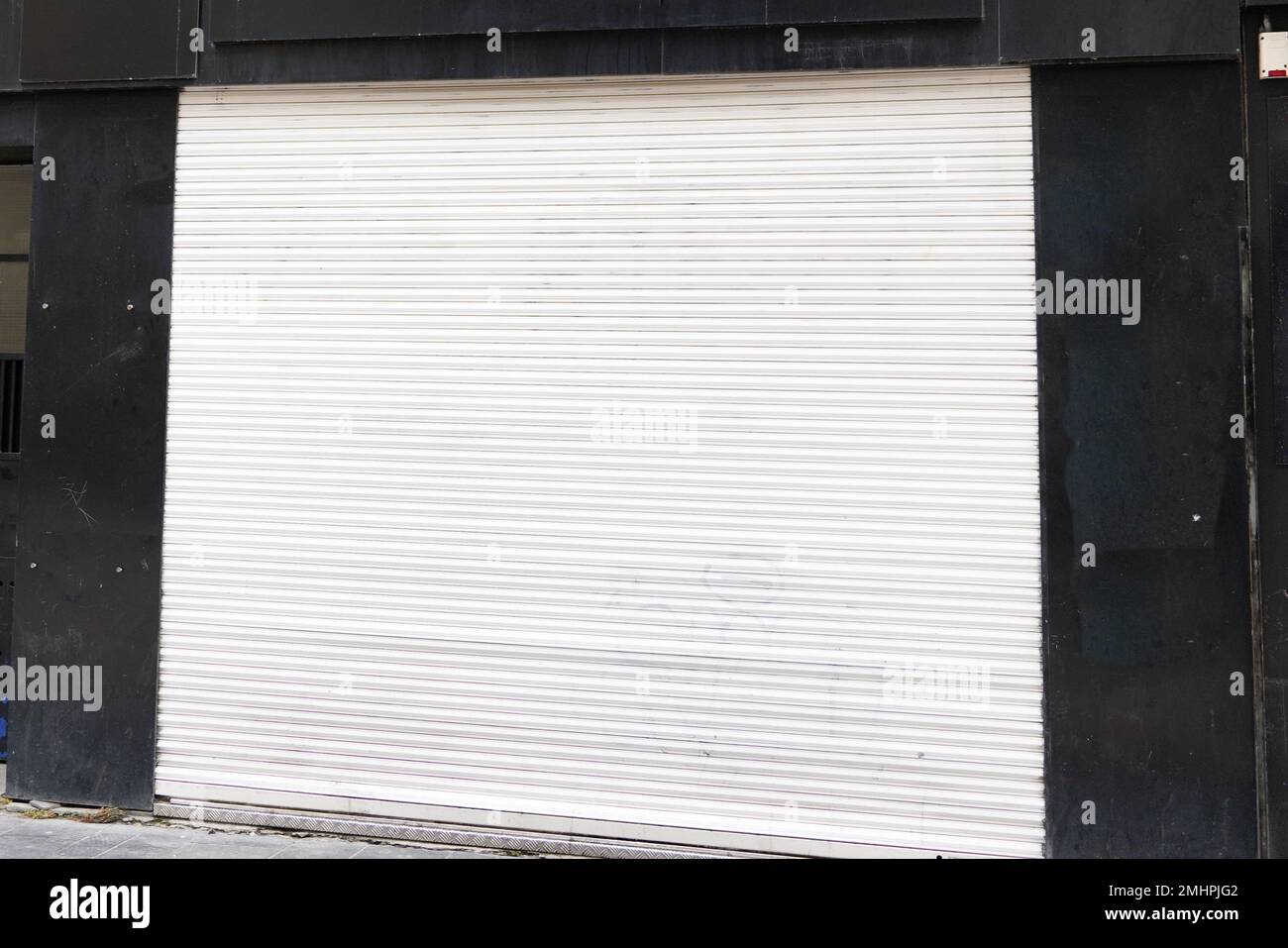 exterior of shop facade with storefront closed door facade of white ...