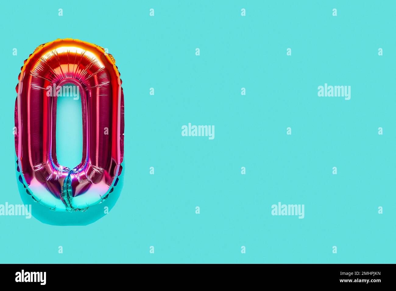 Rainbow foil balloon number, digit zero. Top view. Colored numeral on ...
