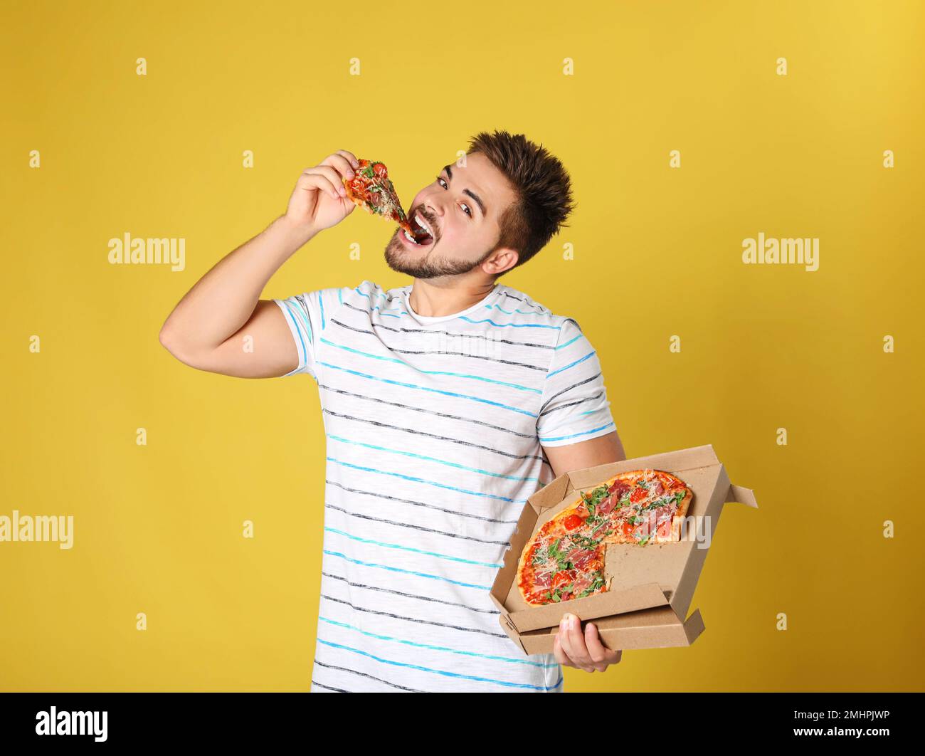 Man person eating eat pizza hi-res stock photography and images - Alamy