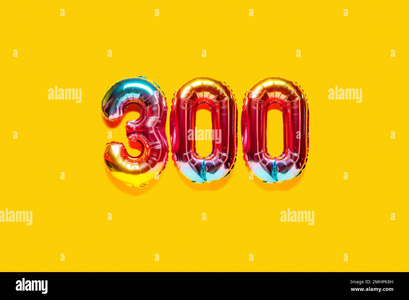 Rainbow foil balloon number, digit three hundred. Top view. Colored ...