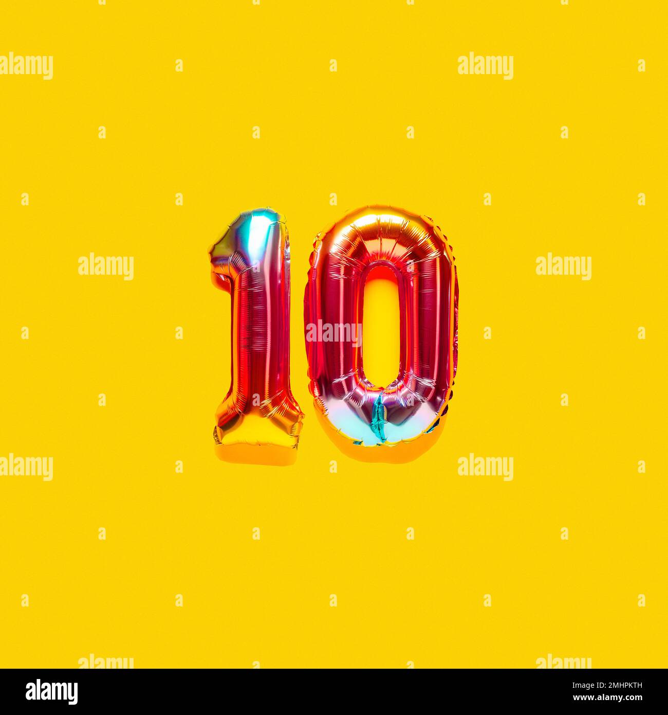 Rainbow foil balloon number, digit ten. Top view. Colored numeral on ...