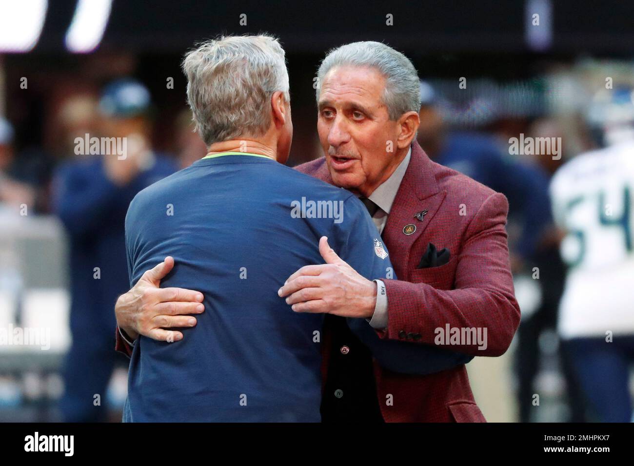 Atlanta Falcons owner Arthur Blank, right, speaks with Seattle Seahawks ...