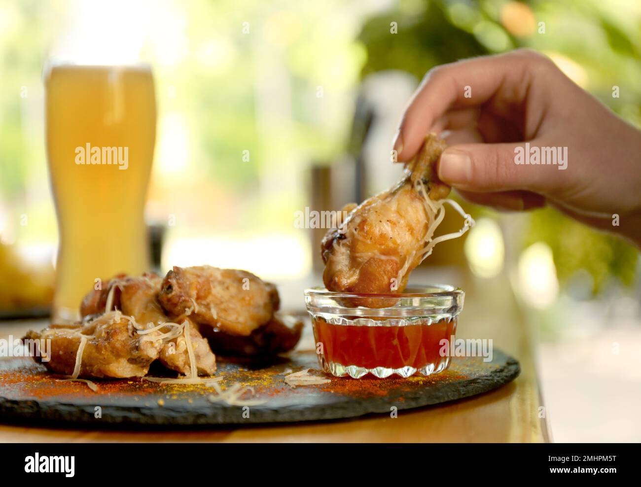 Woman dipping delicious chicken hi-res stock photography and images - Alamy