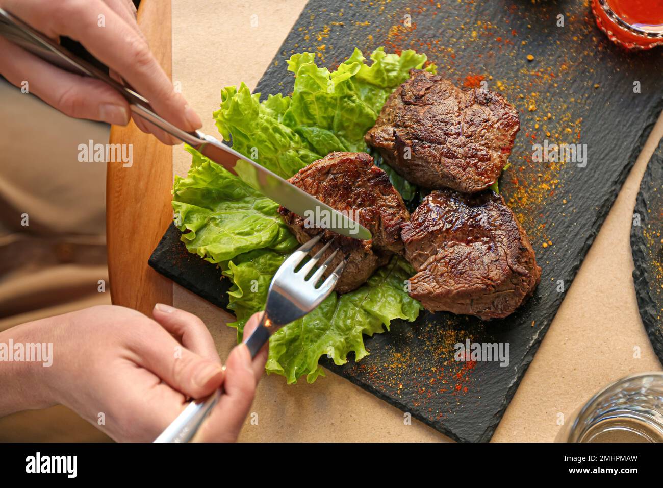 Woman eating tasty shish kebab in cafe Stock Photo - Alamy