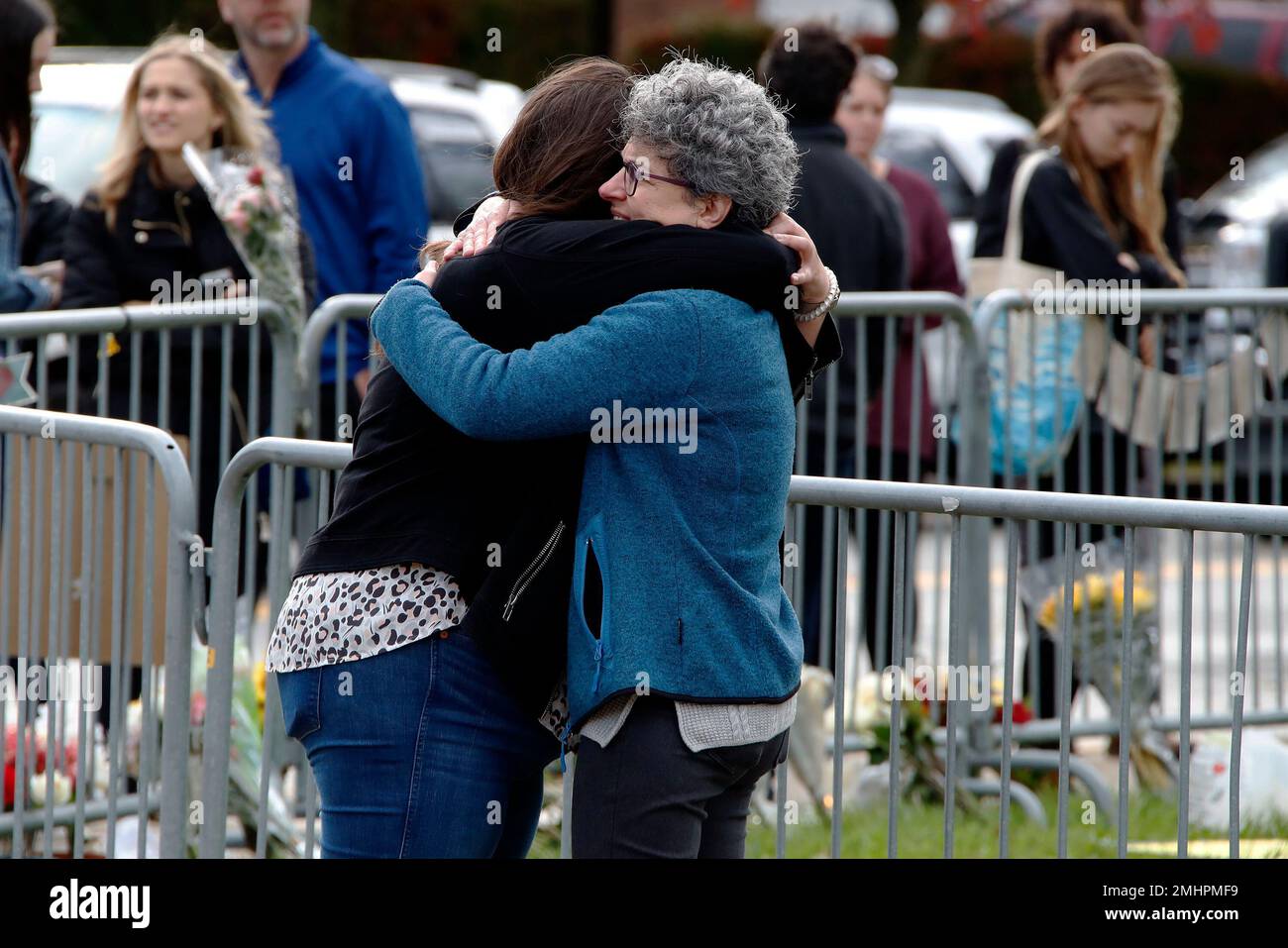 Two women hug outside the Tree of Life synagogue in Pittsburgh on ...