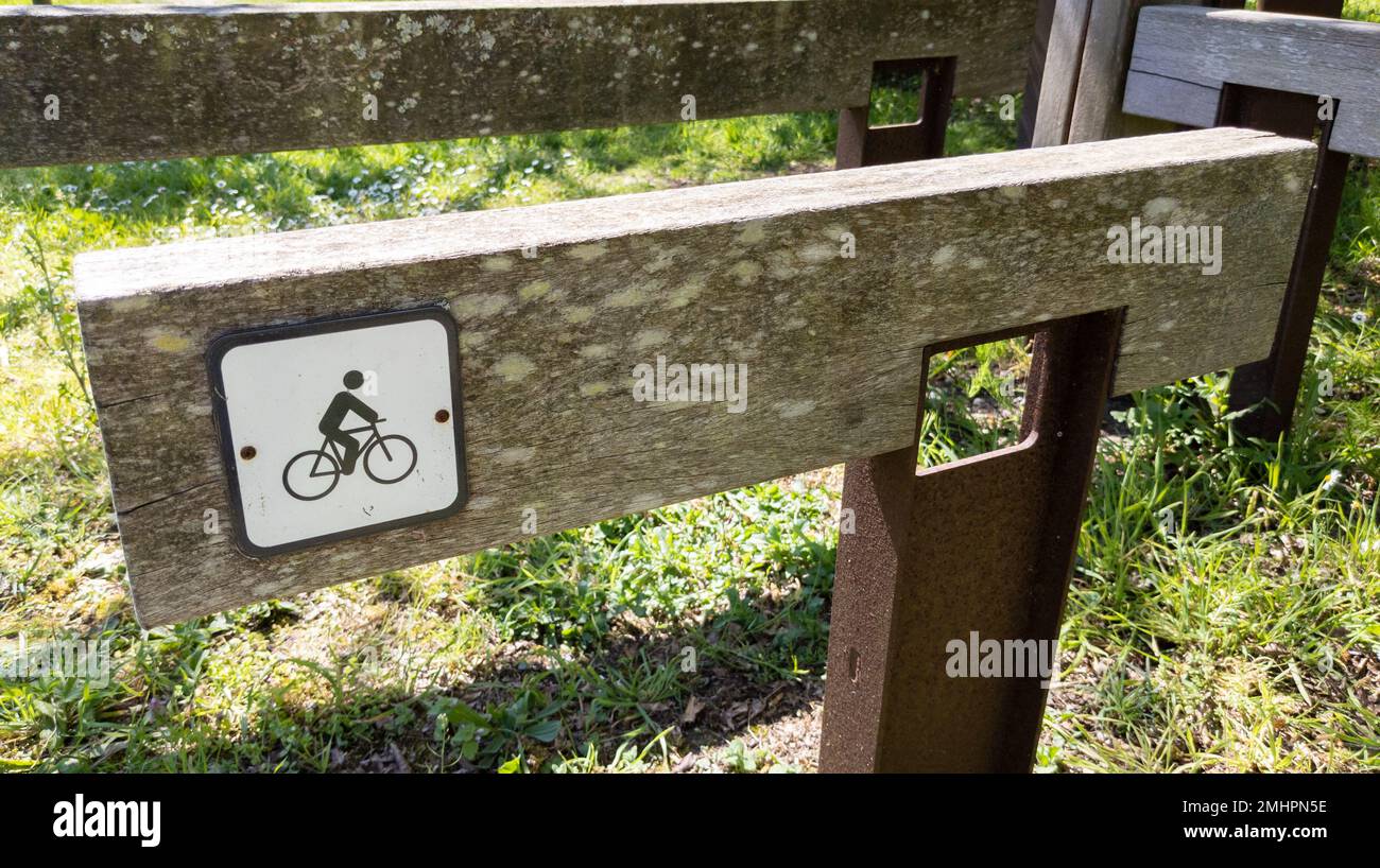 Wooden sign of bike bicycle parking place on park forest background ...