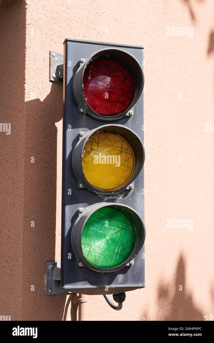 Green traffic light on wall intersection garage residential entrance ...
