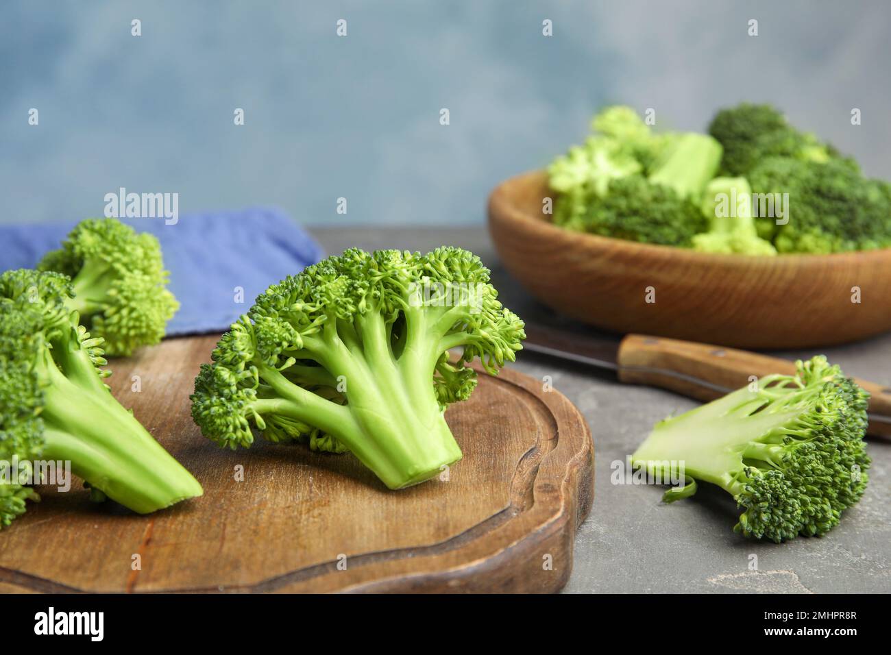 Fresh green broccoli on grey table. Organic food Stock Photo - Alamy
