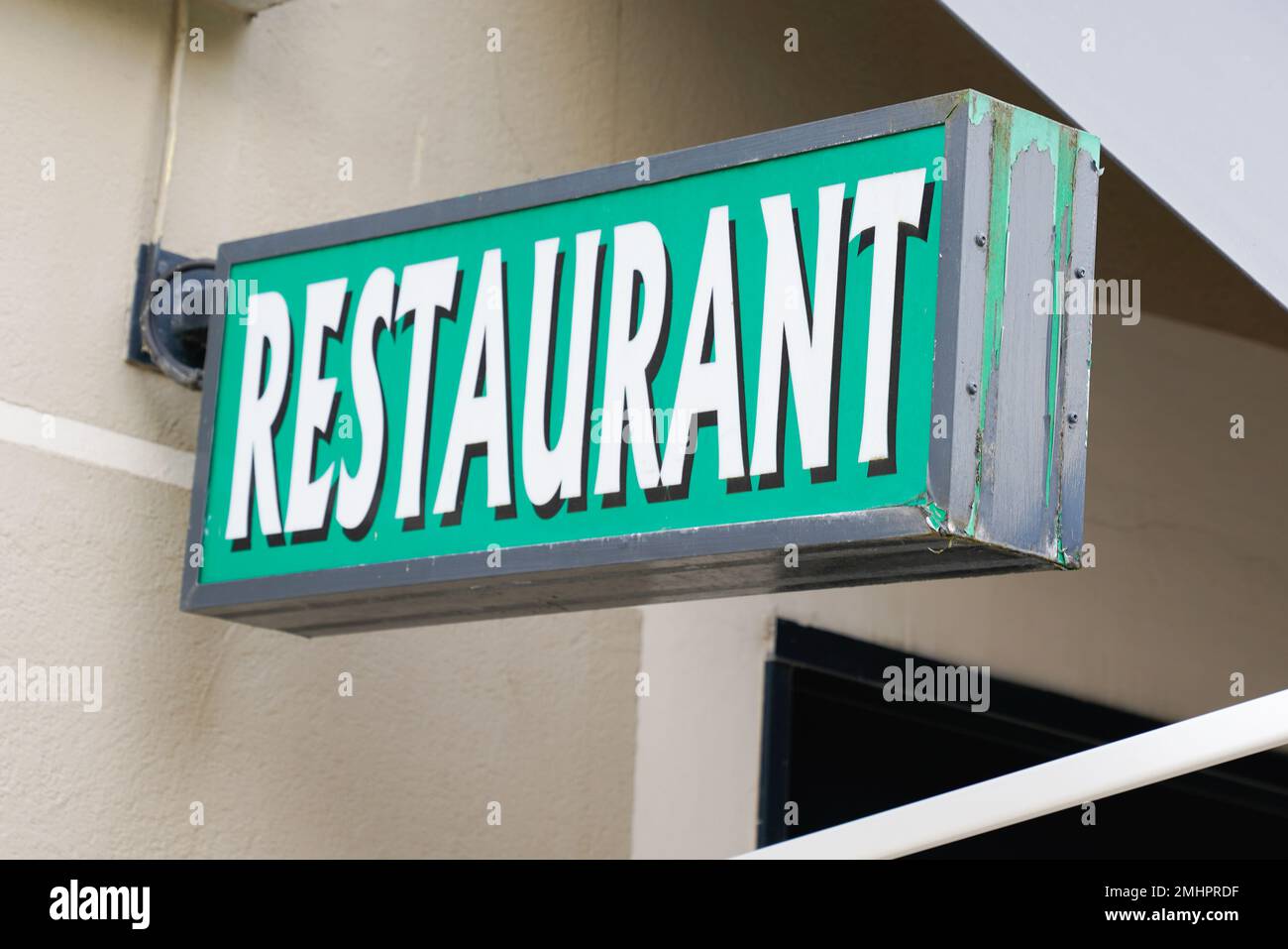 restaurant text sign on bar building facade in street signboard Stock ...