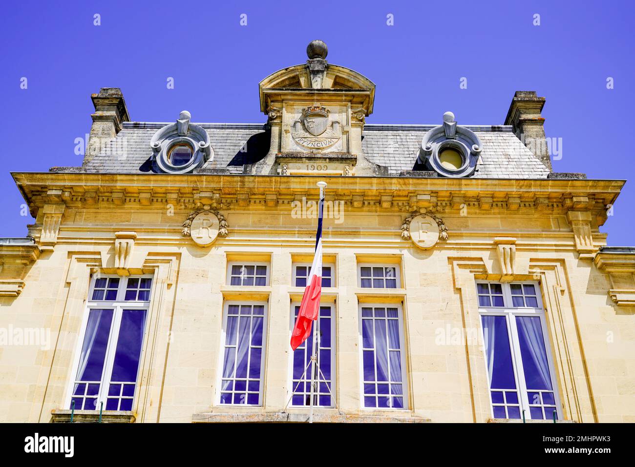 French flag on city Hall wall facade in Rions village France Stock ...