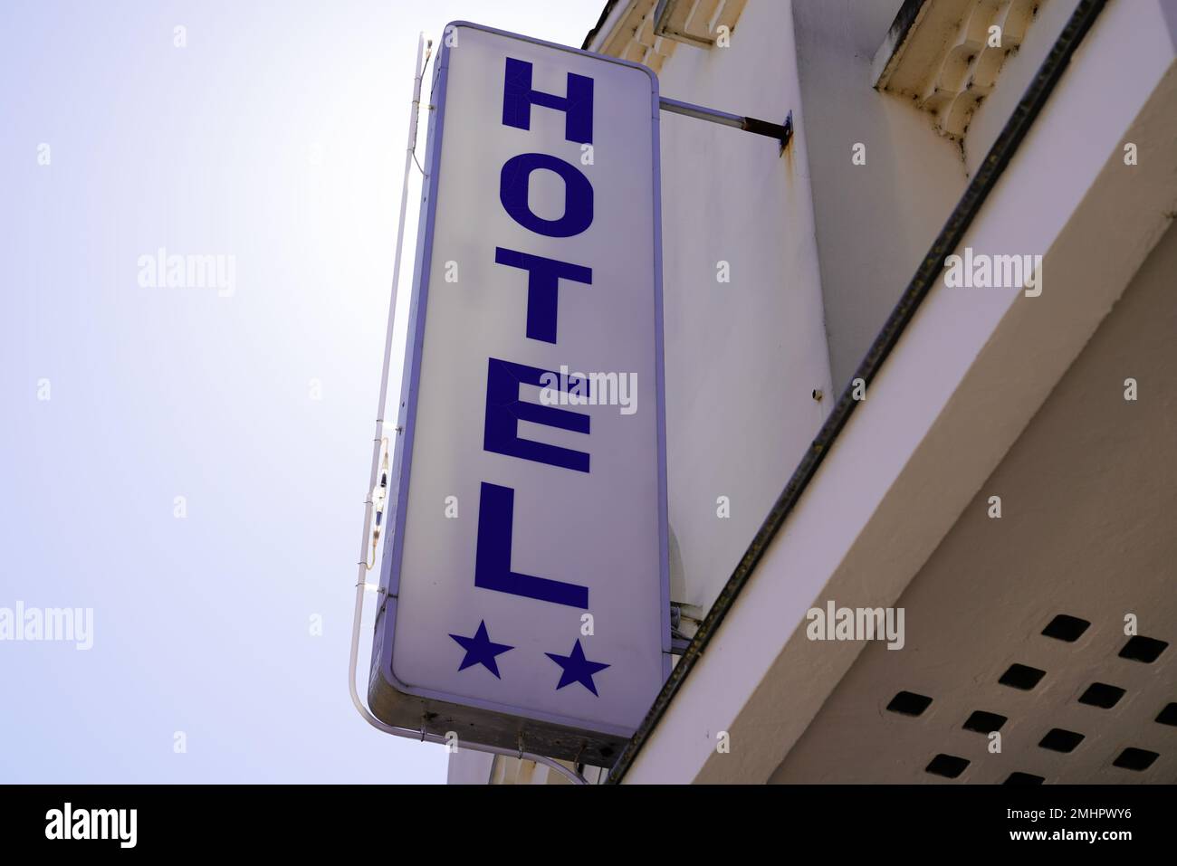 Hotel sign text with two stars in vintage retro on Building in tourist ...