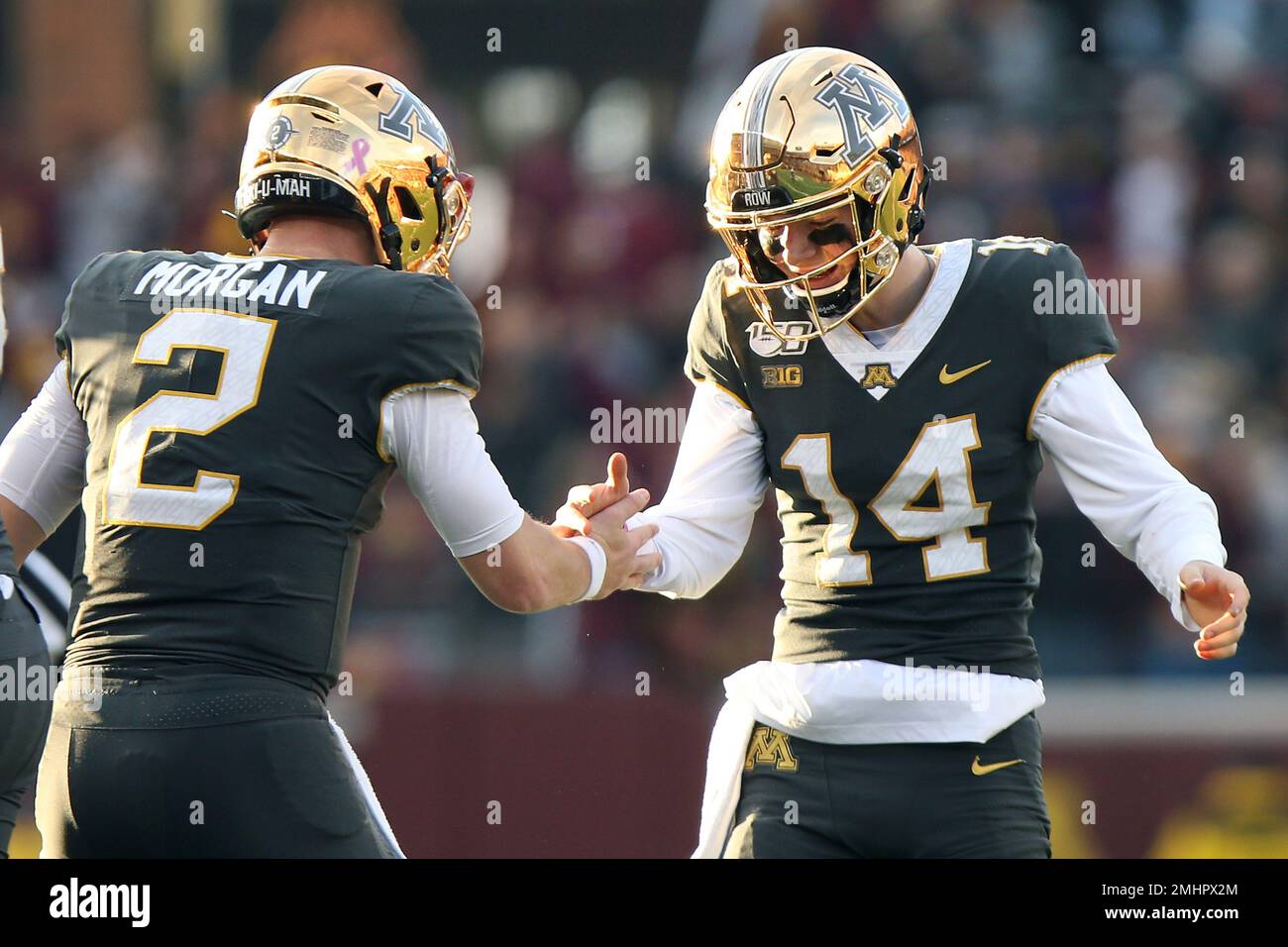 Minnesota quarterback Tanner Morgan (2) celebrates with teammate Casey ...