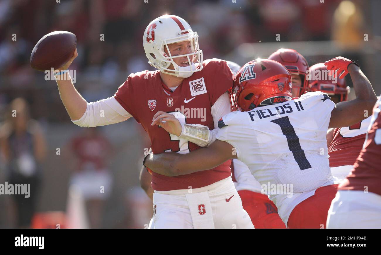 Stanford quarterback K.J. Costello, left, is pressured by Arizona's ...