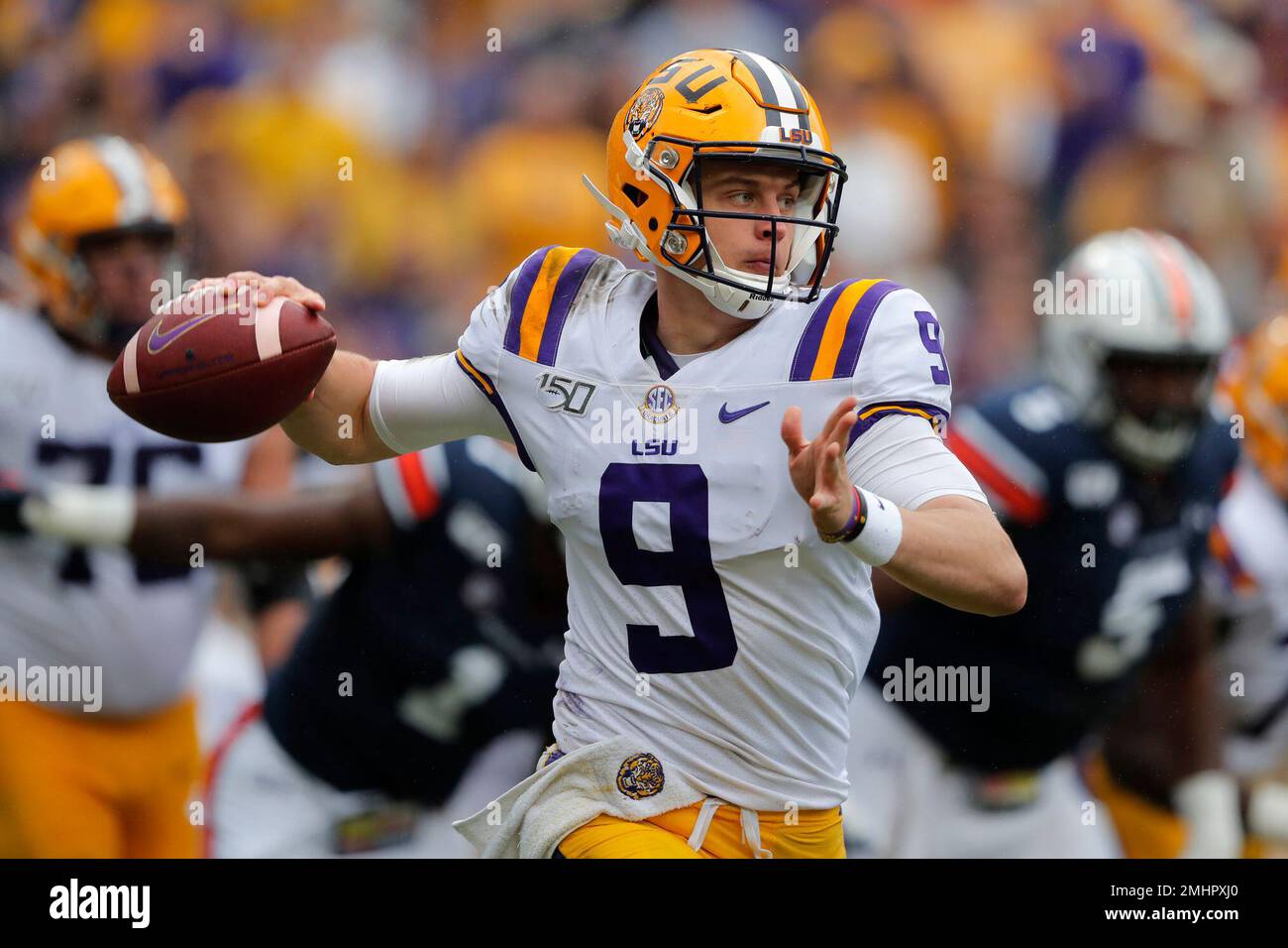 LSU quarterback Joe Burrow (9) scrambles in the first half of an NCAA ...