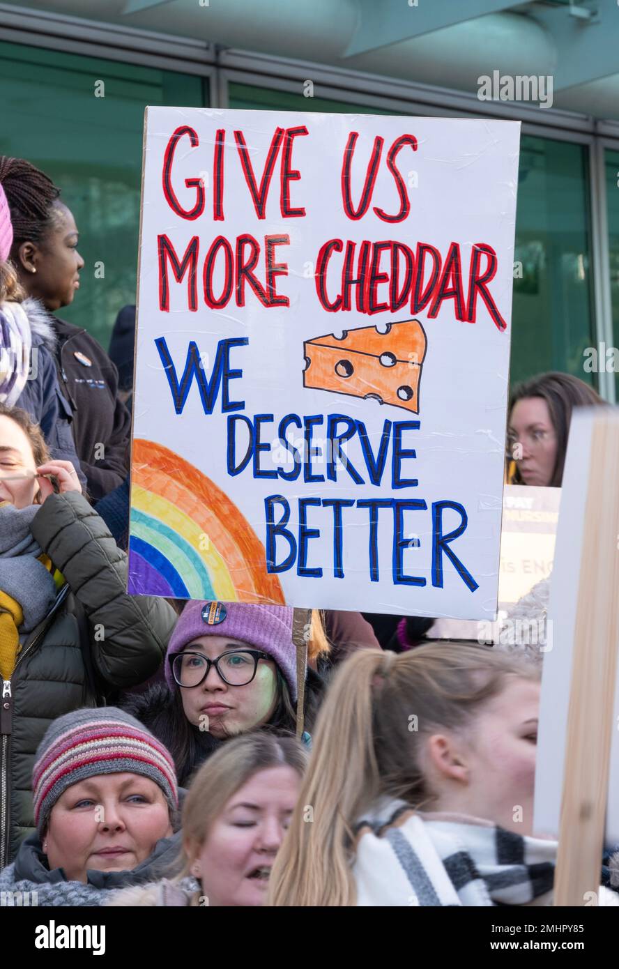Striking nurses with placards, demonstrating outside University College ...