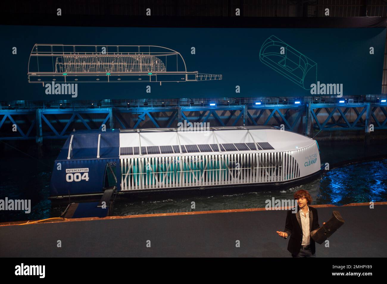 Young Dutch inventor Boyan Slat, right, unveils the Interceptor in ...