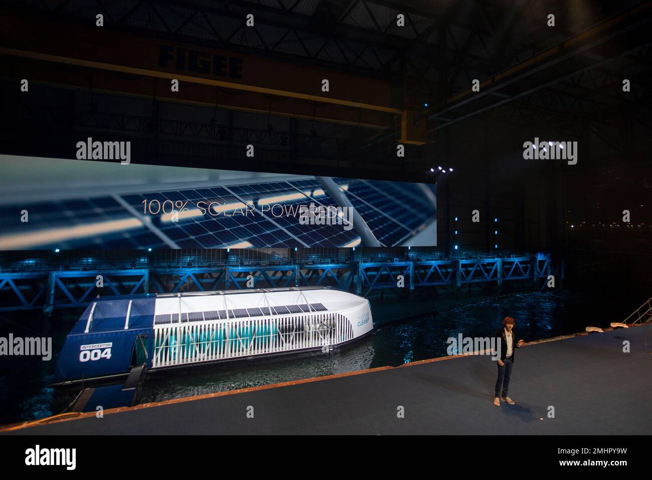 Young Dutch inventor Boyan Slat, right, unveils the Interceptor in ...