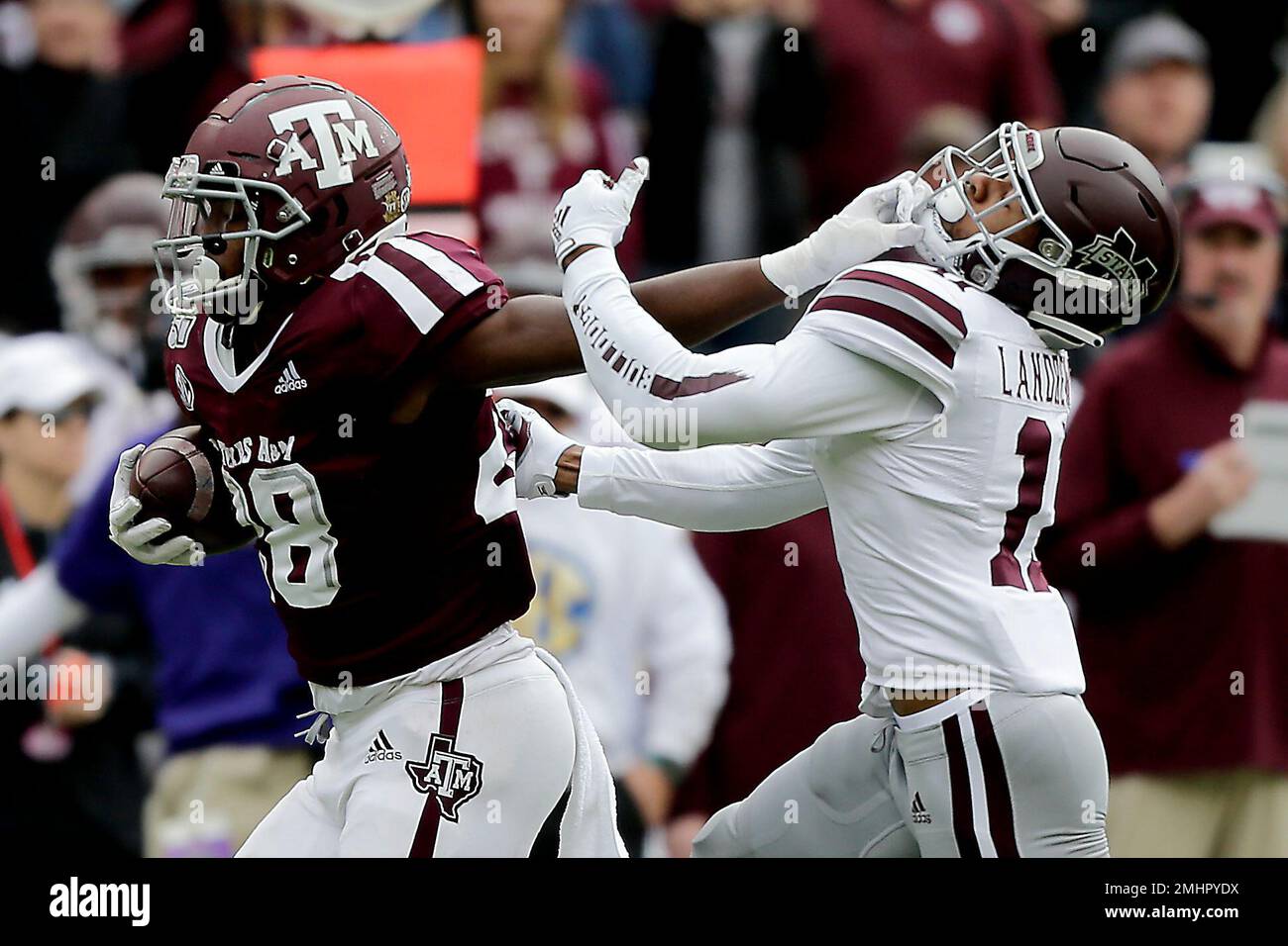 Texas A&M running back Isaiah Spiller (28) stiff arms Mississippi State ...