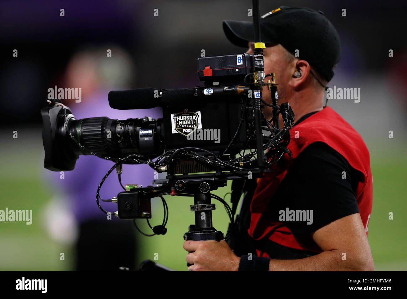 A Fox television steadicam operator work during an NFL football game ...