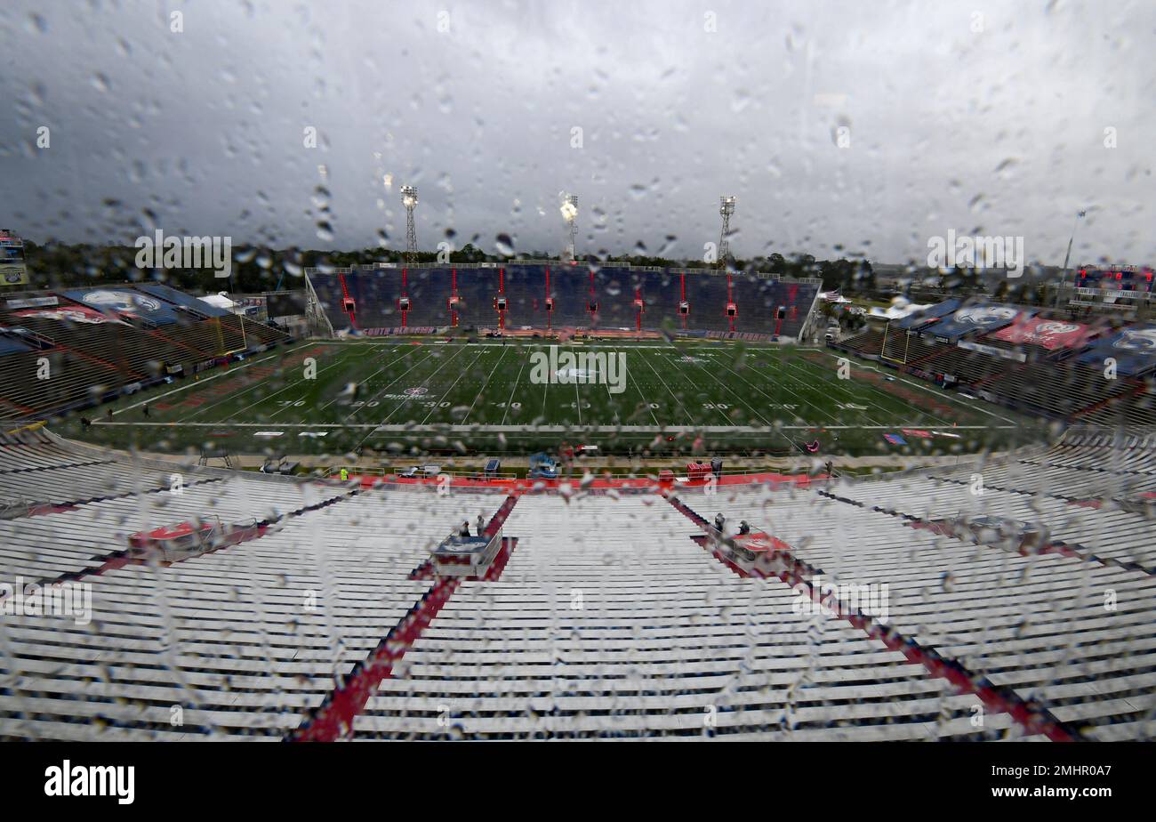 Rain soaks the field at Ladd-Peebles Stadium before the kick between ...