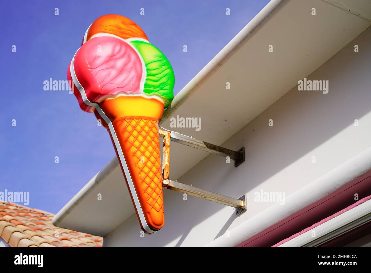 Big plastic Ice cream cone sign in the street Stock Photo - Alamy