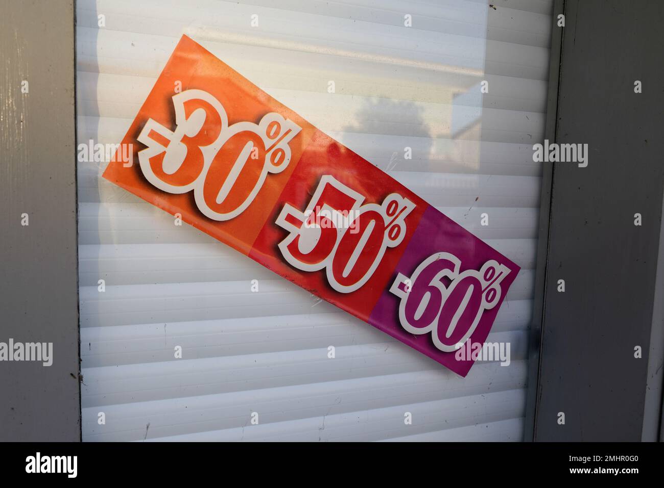 promotional text and discounts on the store window shop Stock Photo - Alamy