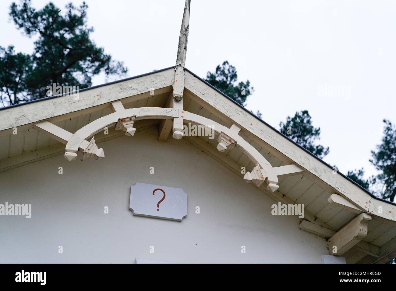 question mark painted on the wall of the exterior façade of a tipic ...