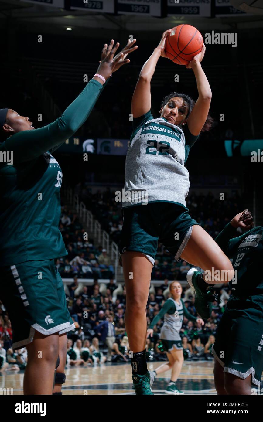 Michigan State's Moira Joiner, right, grabs a rebound against Cydni ...